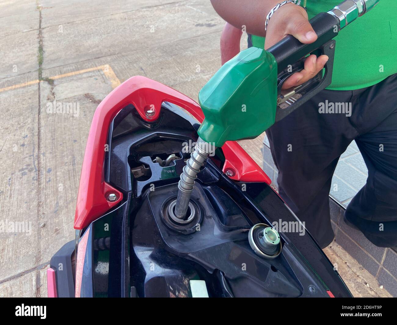 Filling motorcycle tank gas station hi-res stock photography and images ...