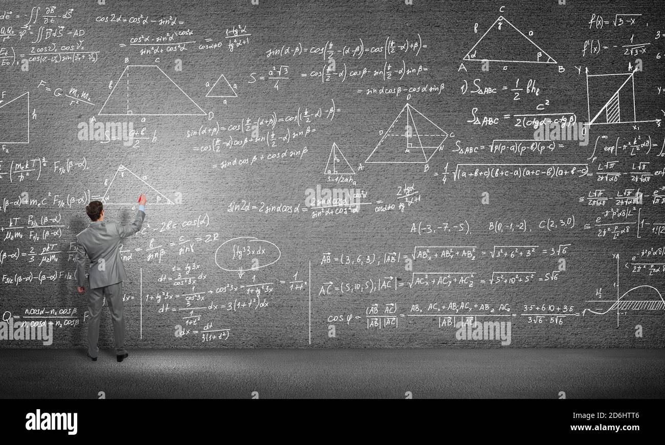 Student or teacher at blackboard Stock Photo - Alamy