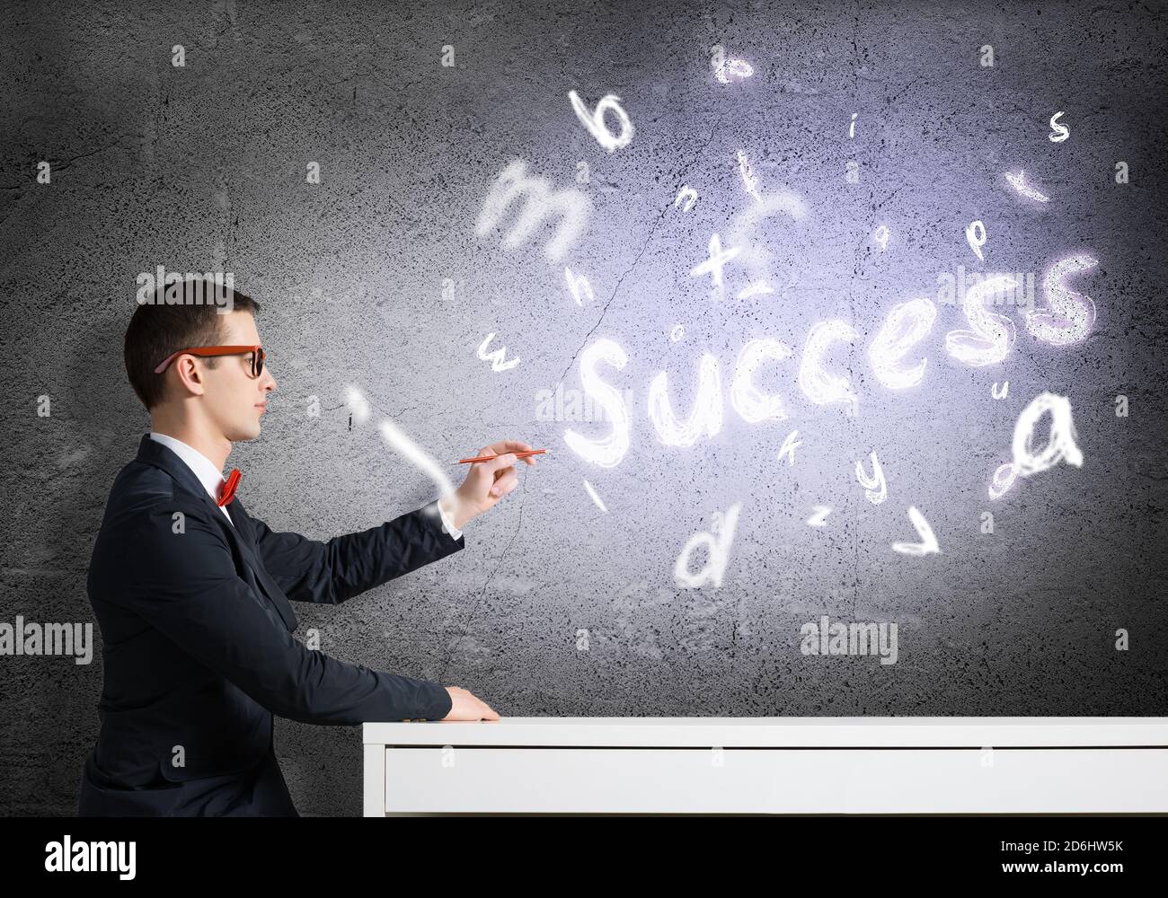 Smart guy draw on wall Stock Photo - Alamy