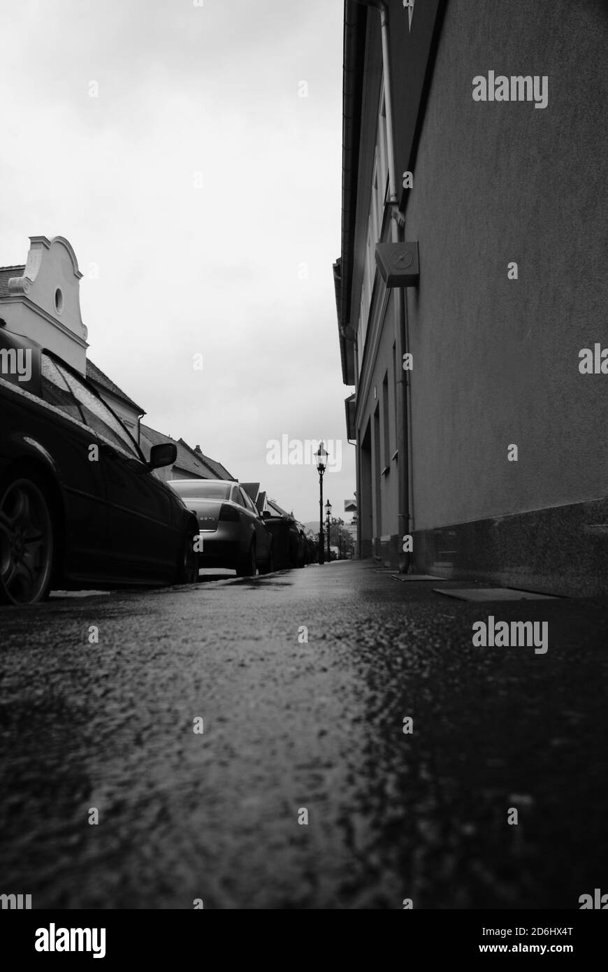 Vertical grayscale shot of a street Stock Photo - Alamy