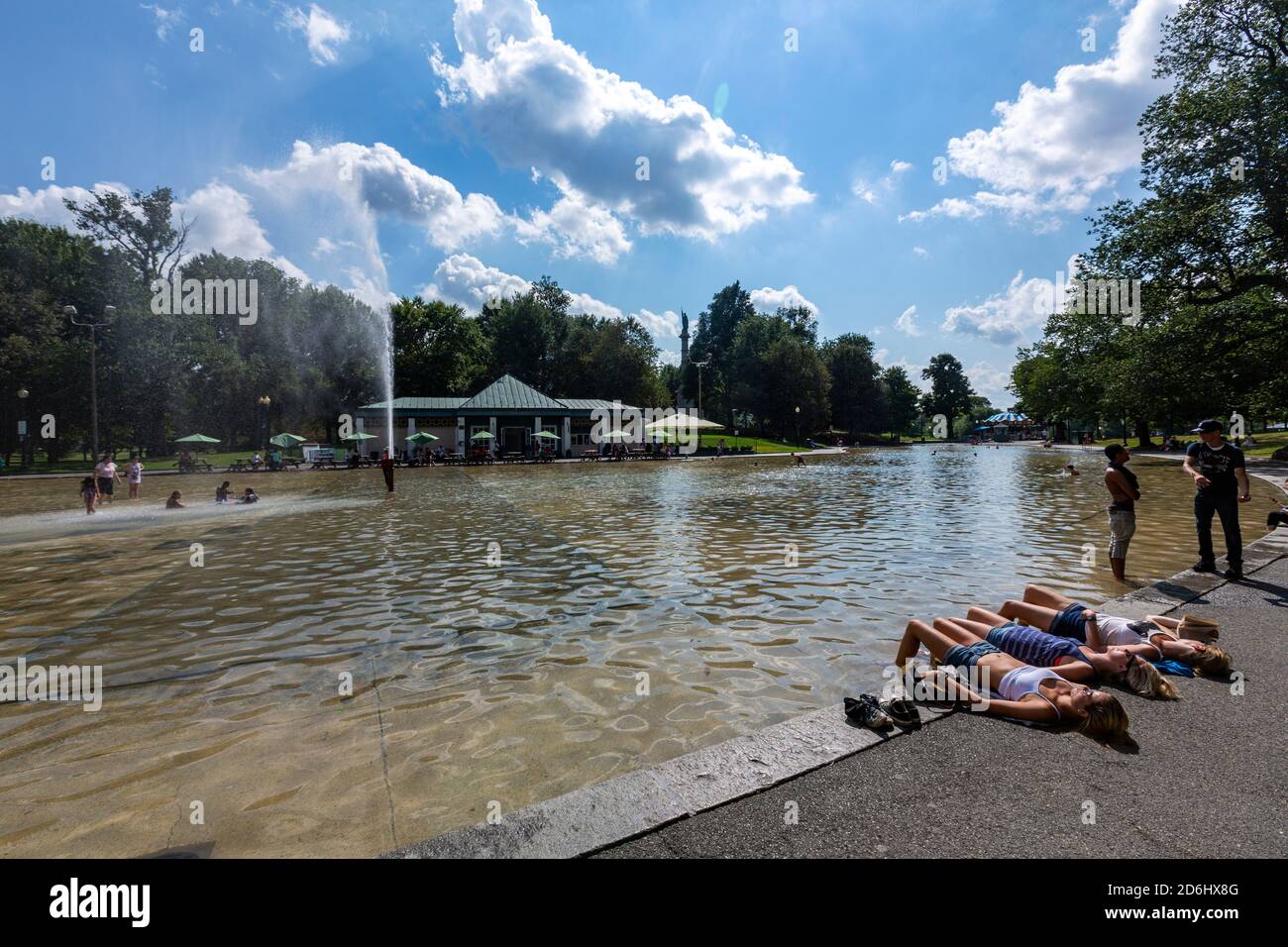 Girls lying having sunbath in The Frog Pond , Boston Common, Boston ...