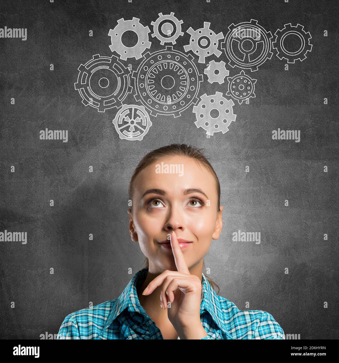 Girl showing hush gesture Stock Photo - Alamy