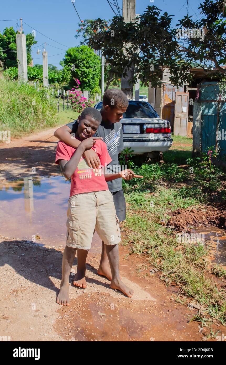 Boys Standing At The Roadside Stock Photo - Alamy