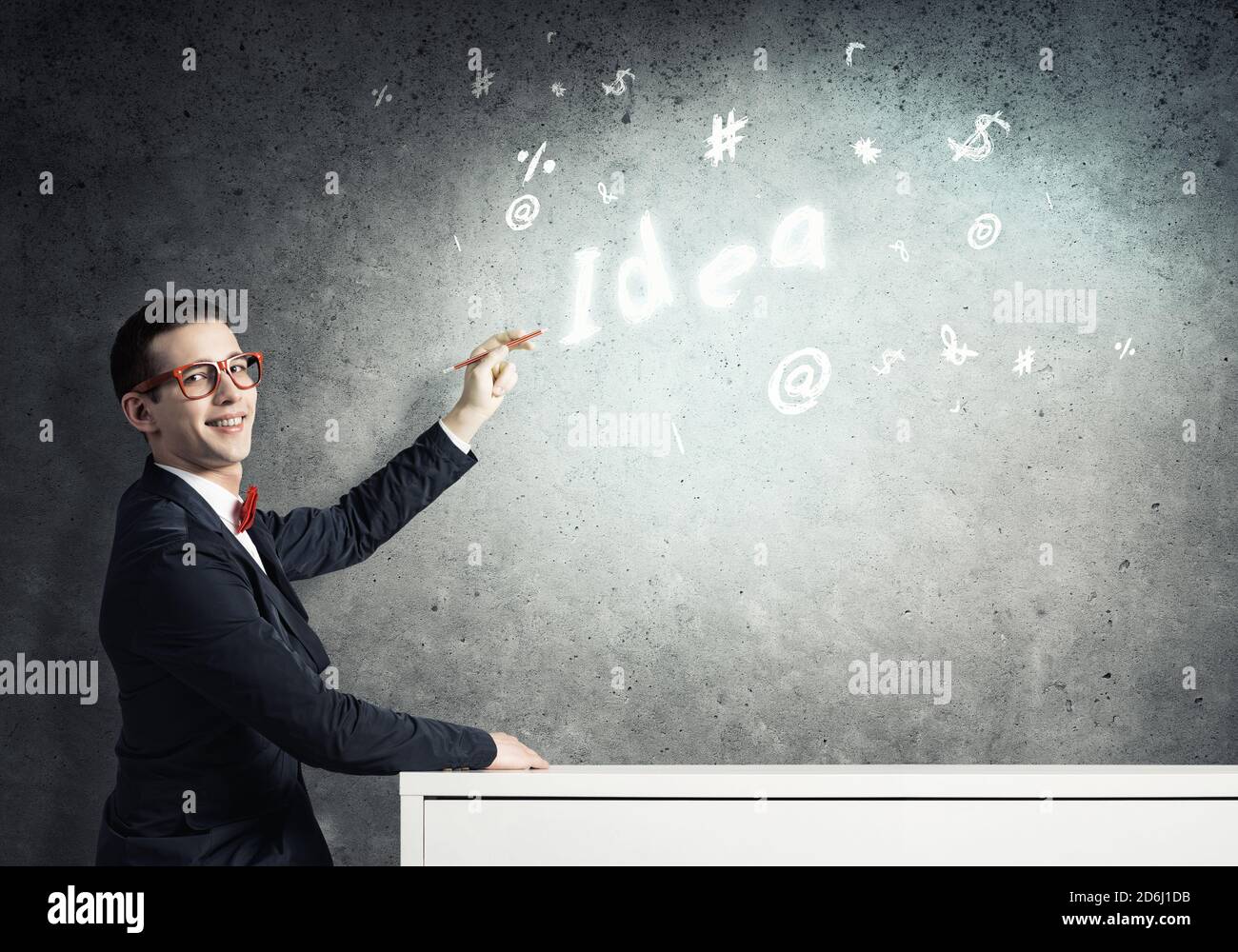 Smart guy draw on wall Stock Photo - Alamy