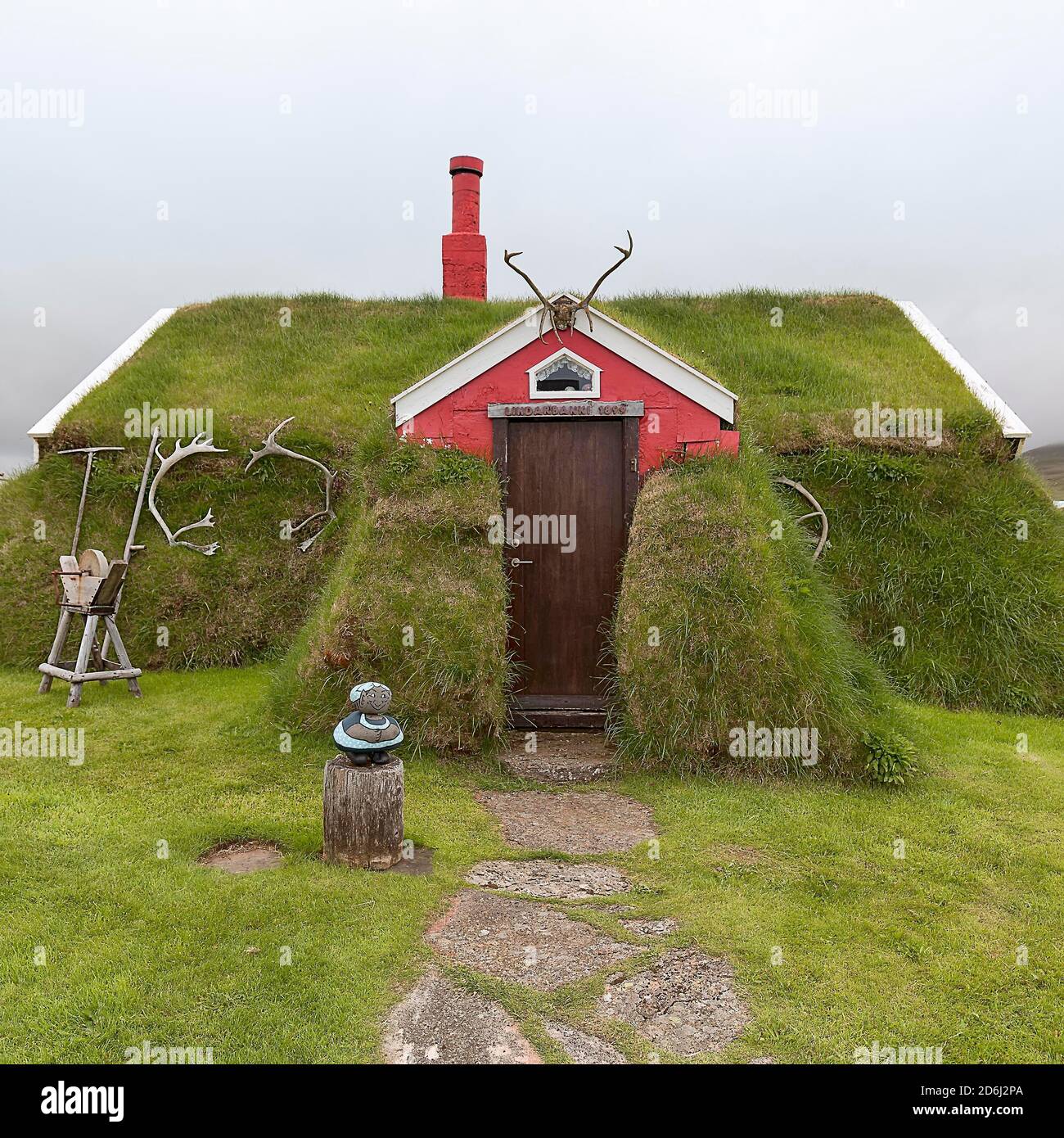 Traditional peat house Lindarbakki overgrown with grass and antlers in ...