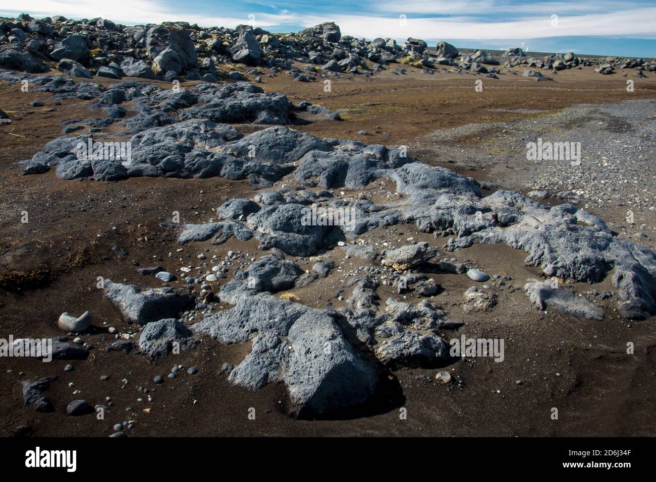 Icelandic beach with volcanic rocks Stock Photo - Alamy