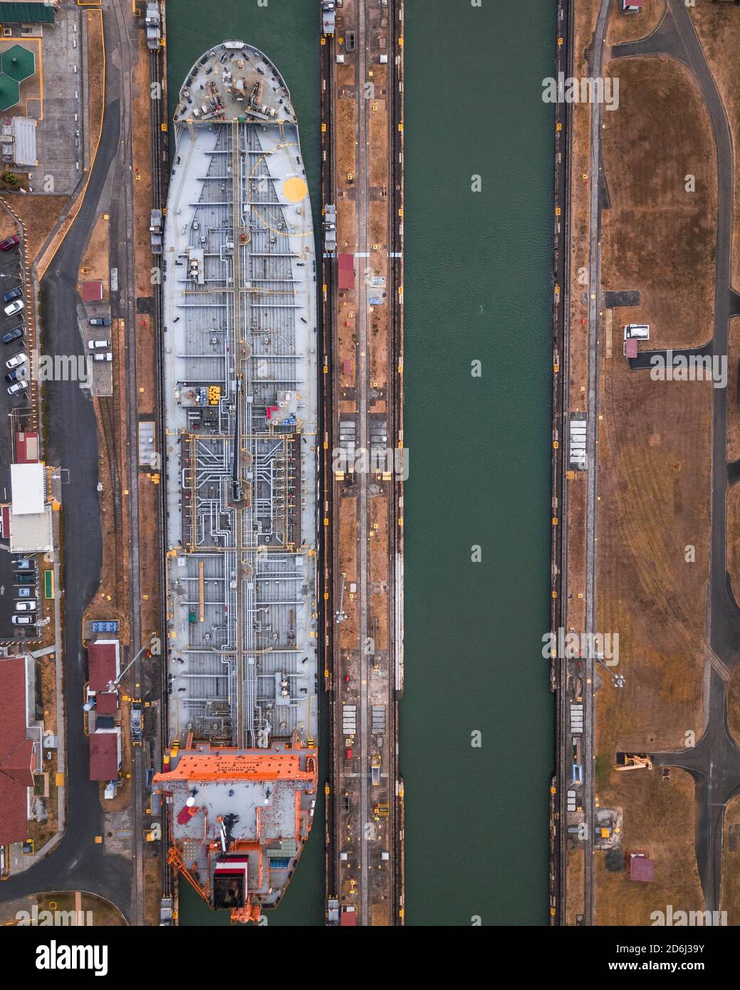 Aerial view, cargo ship at the lock in the Panama Canal from above ...