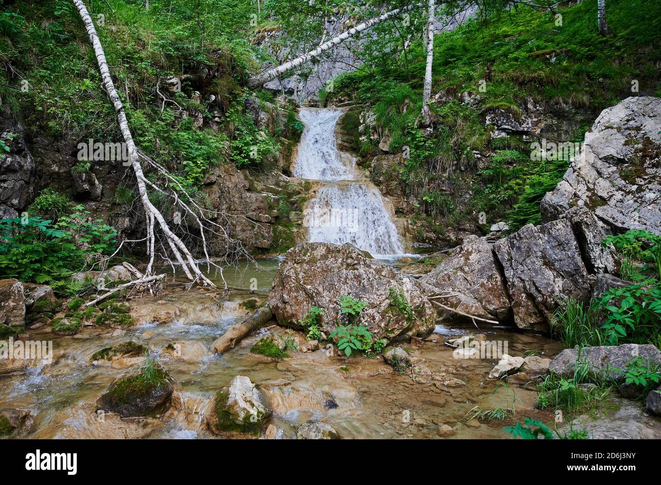 Beautiful nature waterfall on a small lake Stock Photo - Alamy