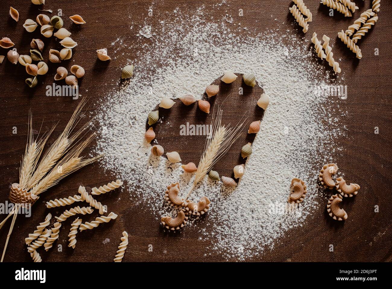 Flour heart with noodles and cereals Stock Photo - Alamy