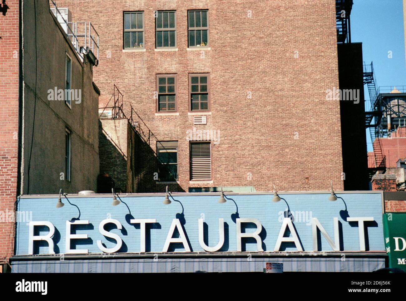 Blue & White Restaurant Sign on Building Stock Photo - Alamy