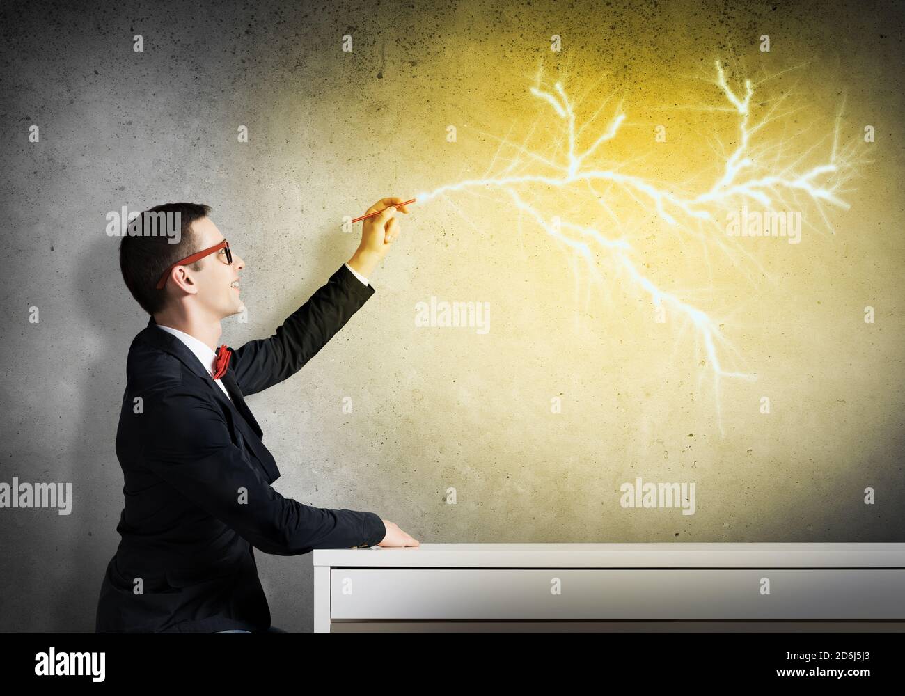 Smart guy draw on wall Stock Photo - Alamy