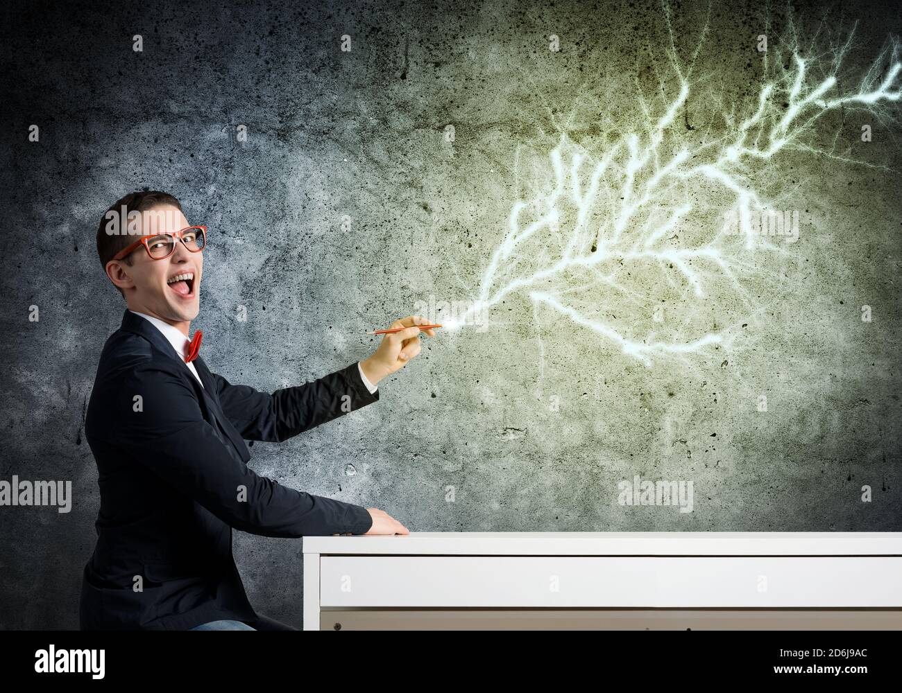 Smart guy draw on wall Stock Photo - Alamy