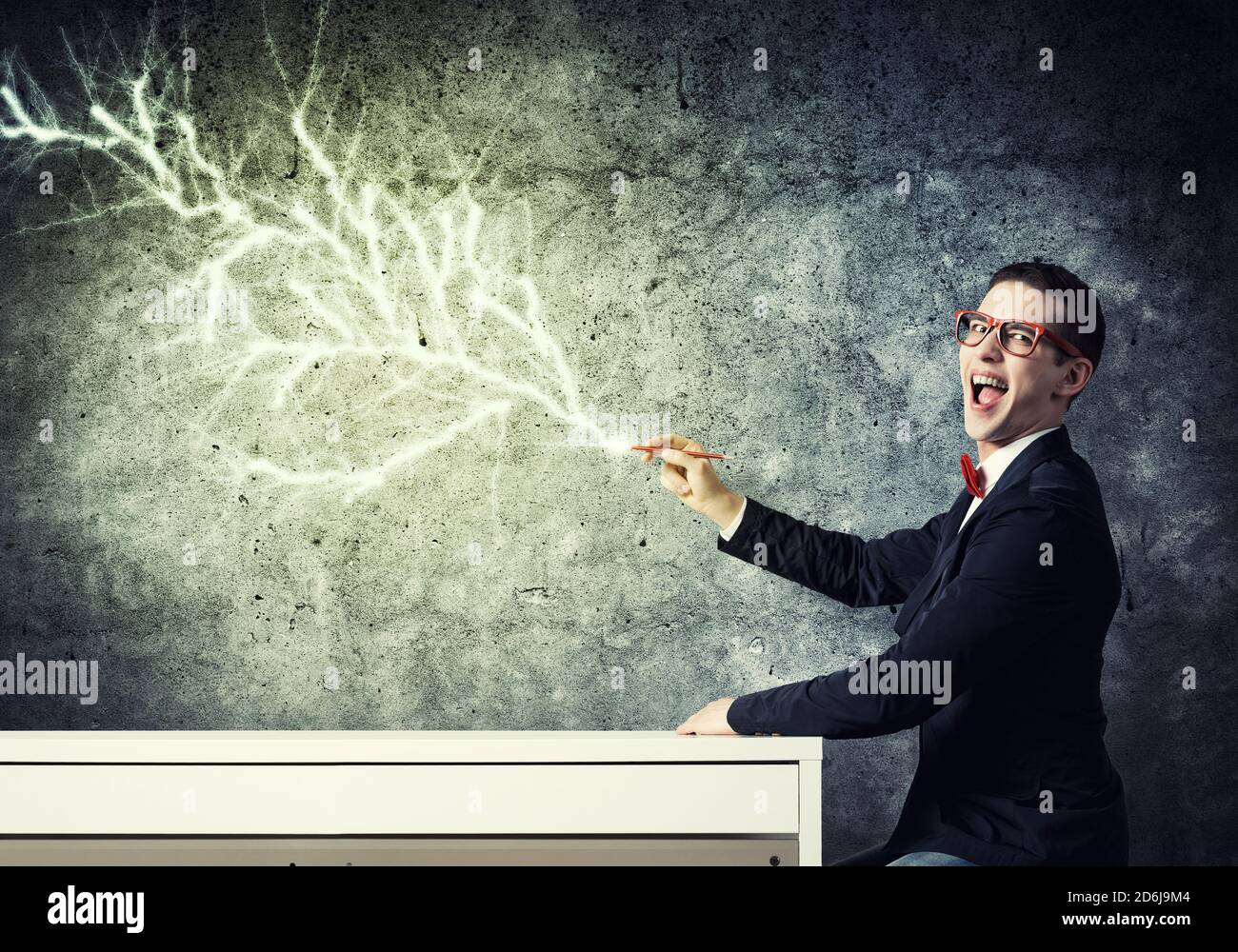 Smart guy draw on wall Stock Photo - Alamy