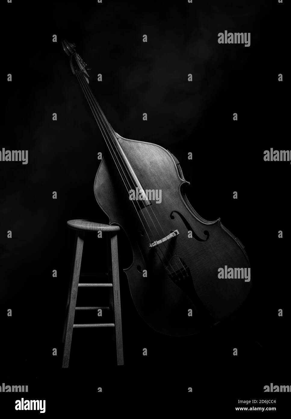 A double bass sits on a stool with a slightly smoky environment Stock ...