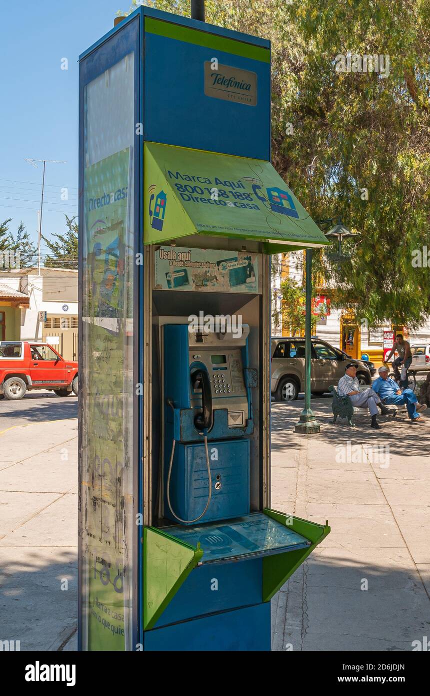 Vicuna, Chile - December 7, 2008: Downtown. Public blue-green telephone ...