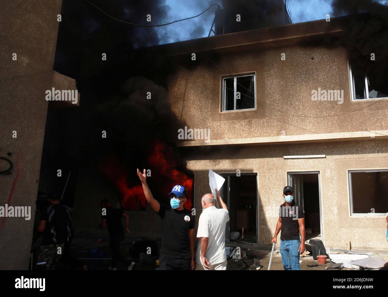 Baghdad. 17th Oct, 2020. Smoke rises at the headquarters of the ...