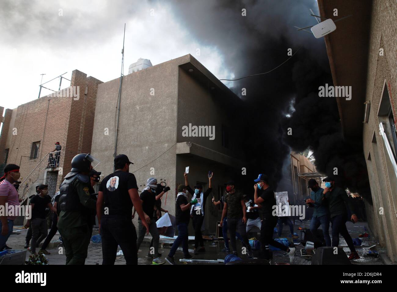 Baghdad. 17th Oct, 2020. Protesters are seen at the headquarters of the ...
