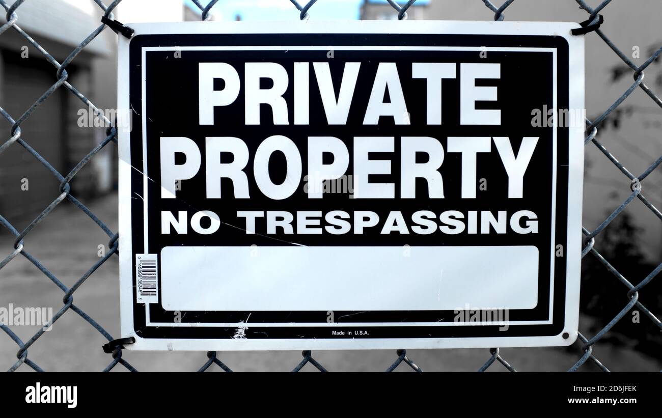 Metal Fence with Black and White Private Property No Trespassing ...