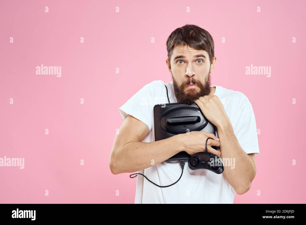 Man with prefix in hand joystick games lifestyle fun pink background ...