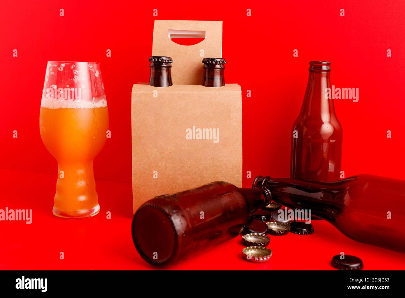 IPA beer glass and various bottles with red background Stock Photo - Alamy