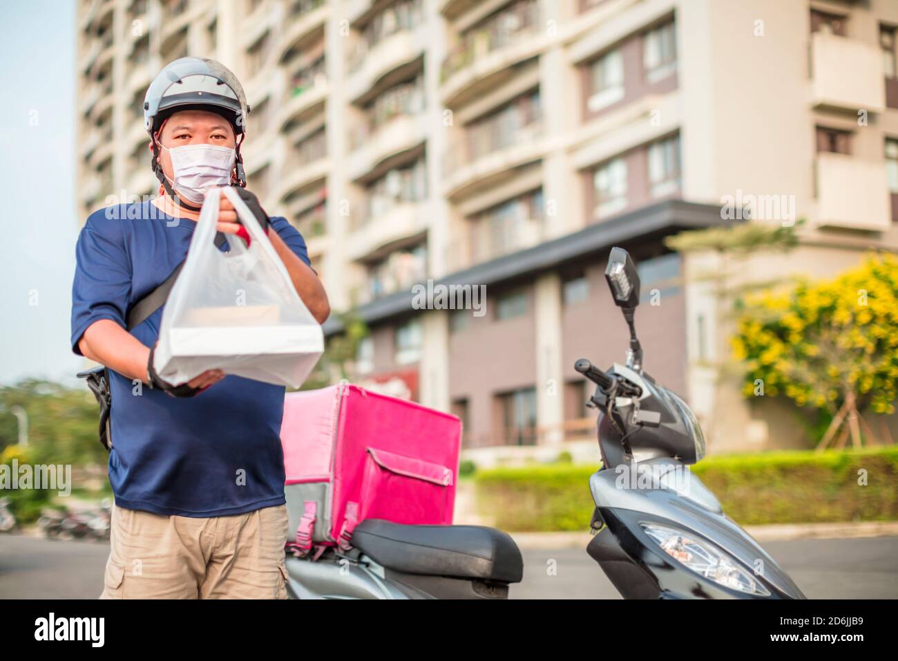 food delivery staff ride motorcycles to deliver food Stock Photo - Alamy
