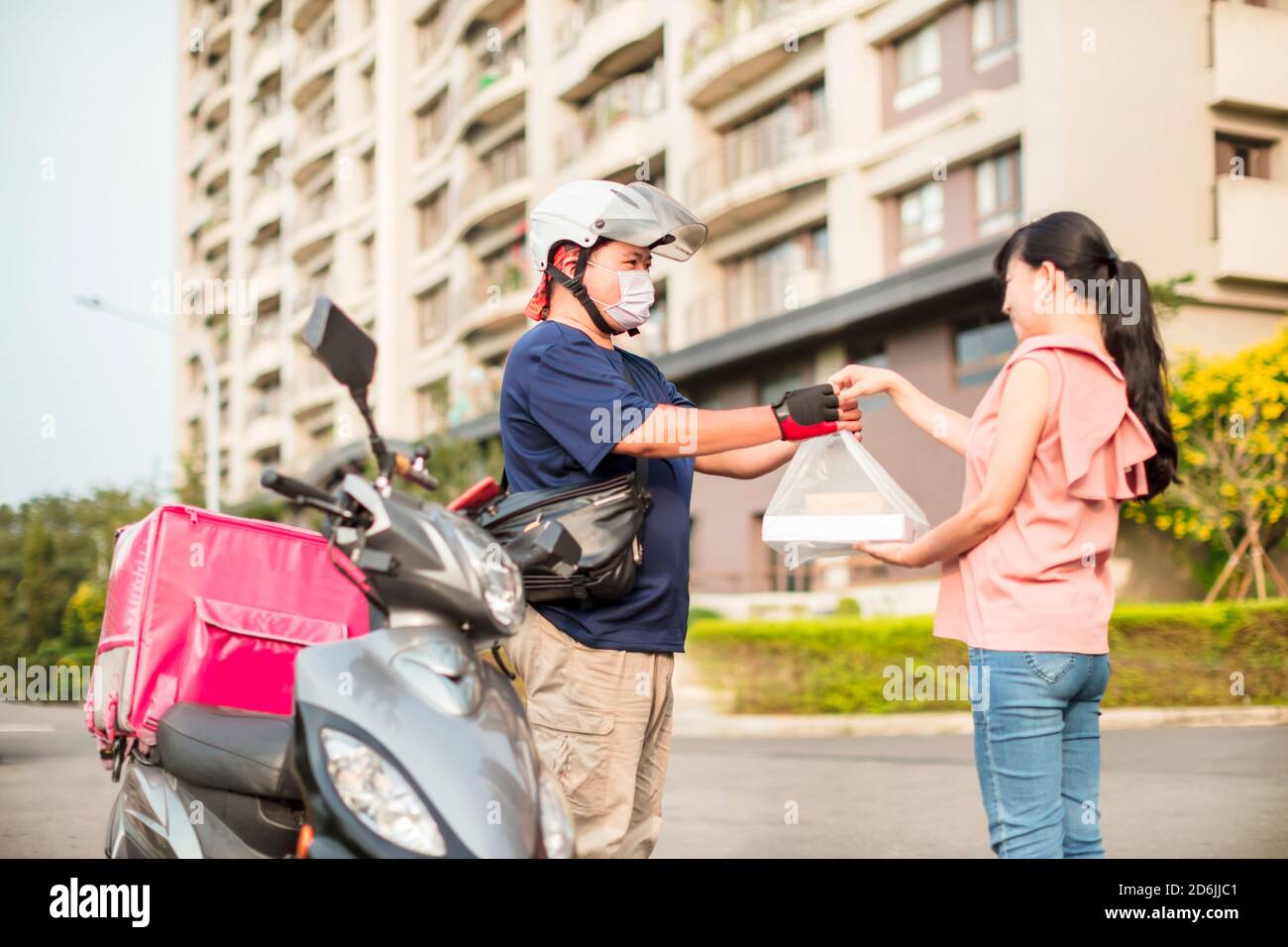 food delivery staff ride motorcycles to deliver food Stock Photo - Alamy