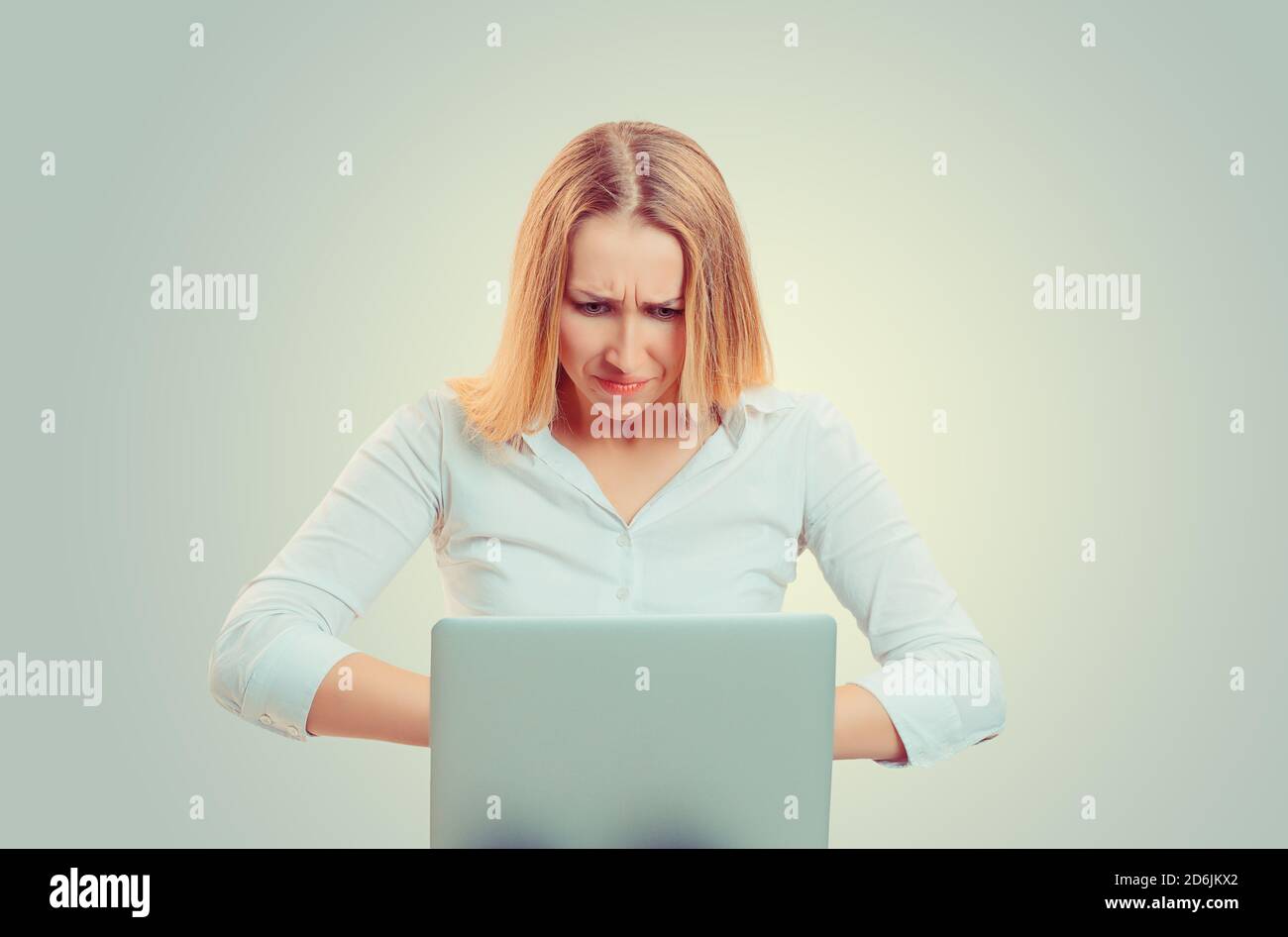 Girl frustrated with labtop. Closeup blonde beautiful young woman ...