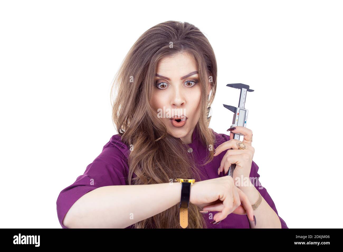 My client is late. Beautiful girl shocked looking at wristwatch ...