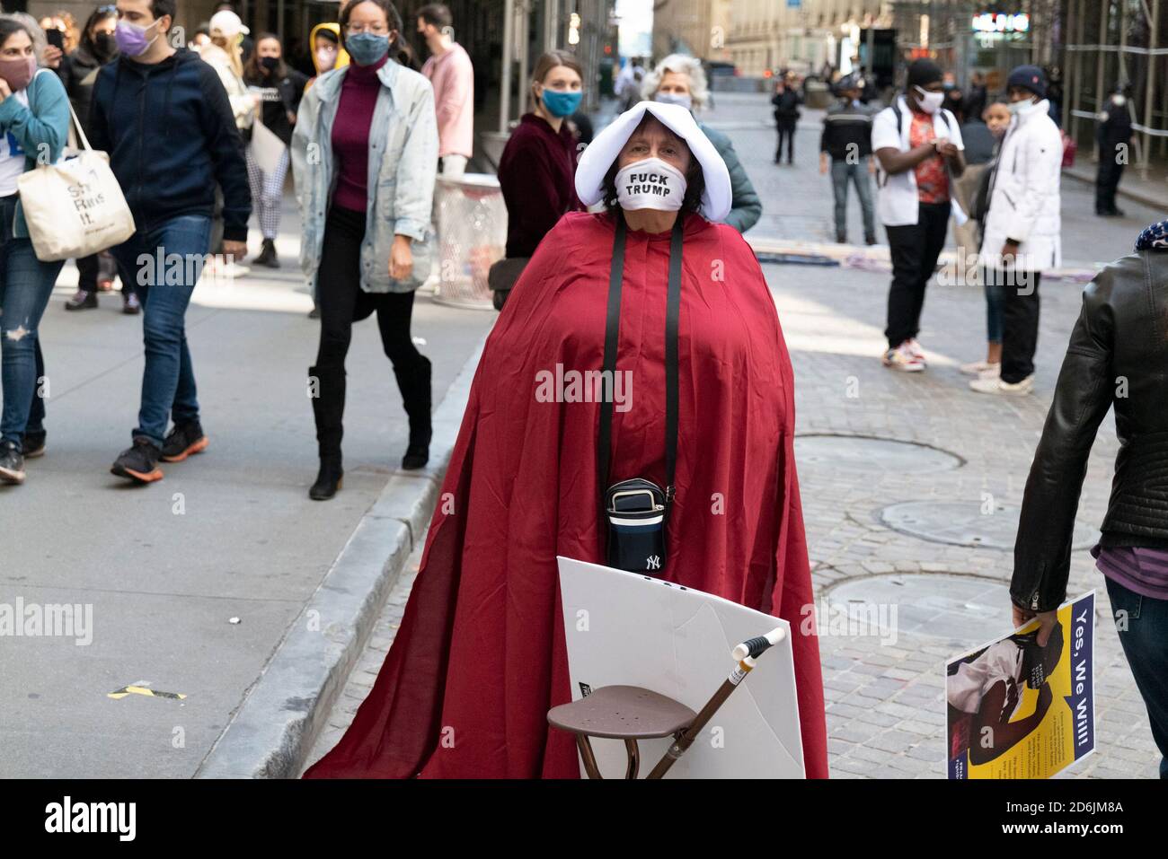 New York, New York, USA. 17th Oct, 2020. Wearing costumes and carrying ...
