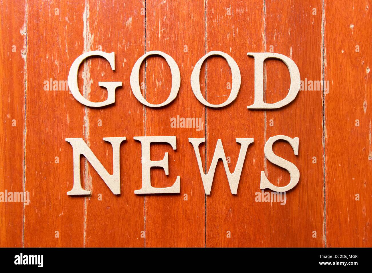 Alphabet letter in word good news on old red color wood plate ...