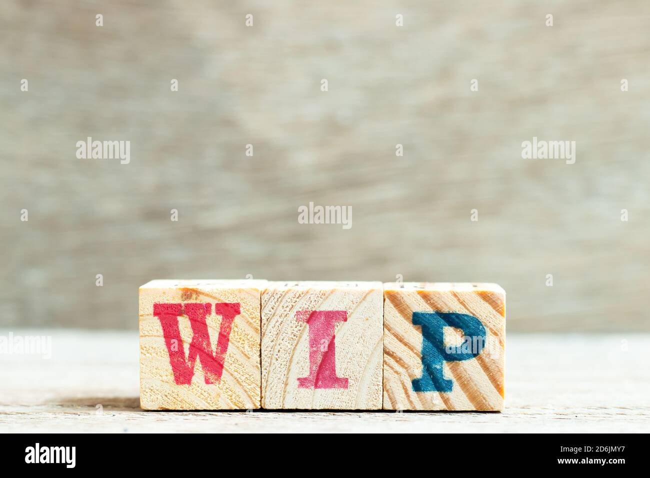 Alphabet letter in word WIP (Abbreviation of work in progress) on wood ...