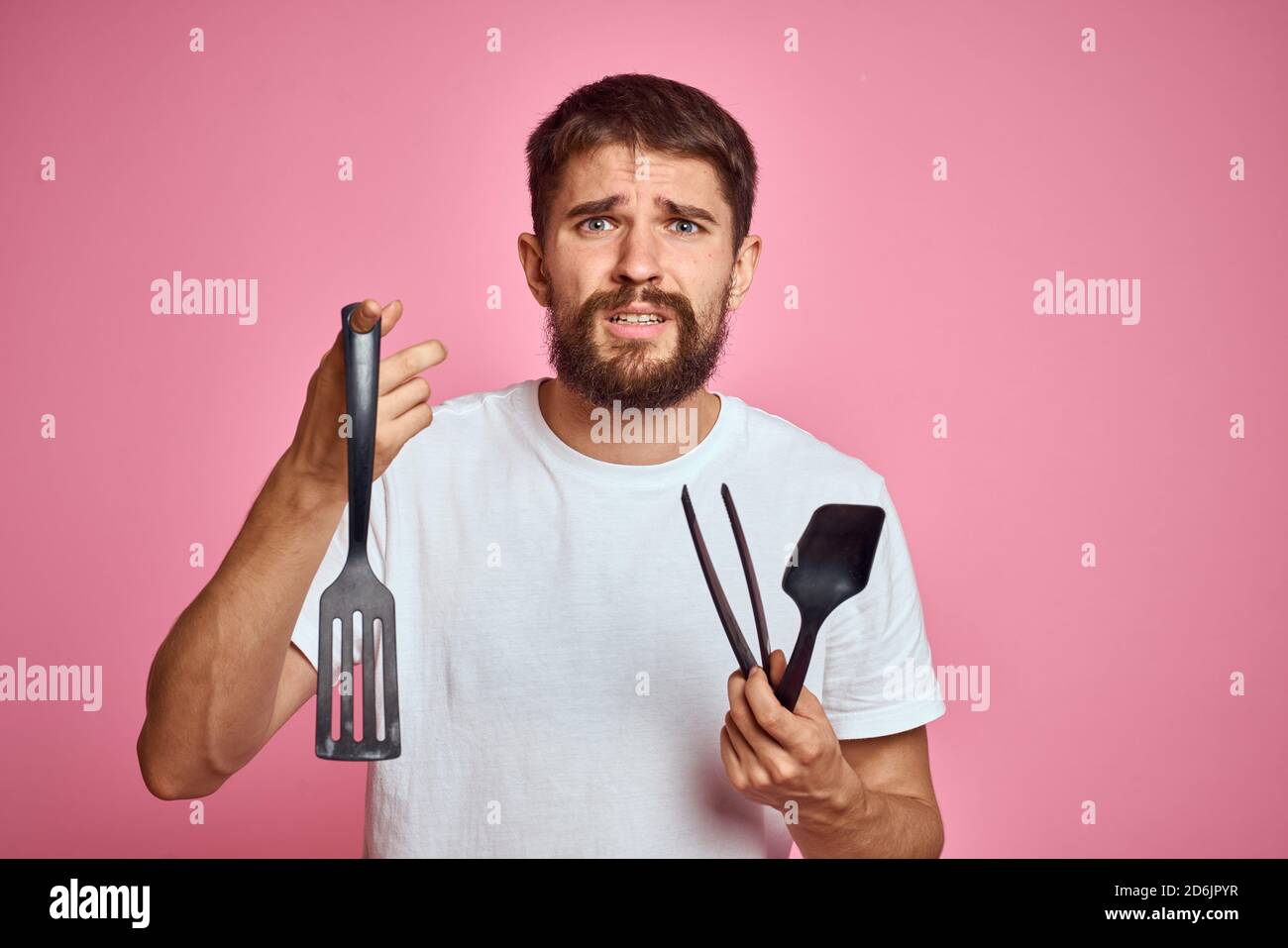 sad man with kitchen tools in hands scoop scoop emotions Stock Photo ...