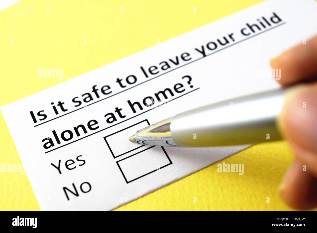 It is safe to leave your child alone at home? Yes or no Stock Photo - Alamy