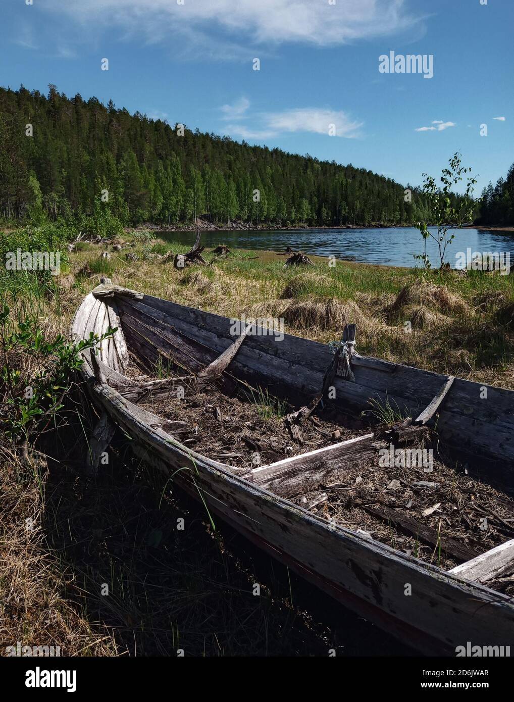 Old and rotten rowboat near the river Stock Photo - Alamy