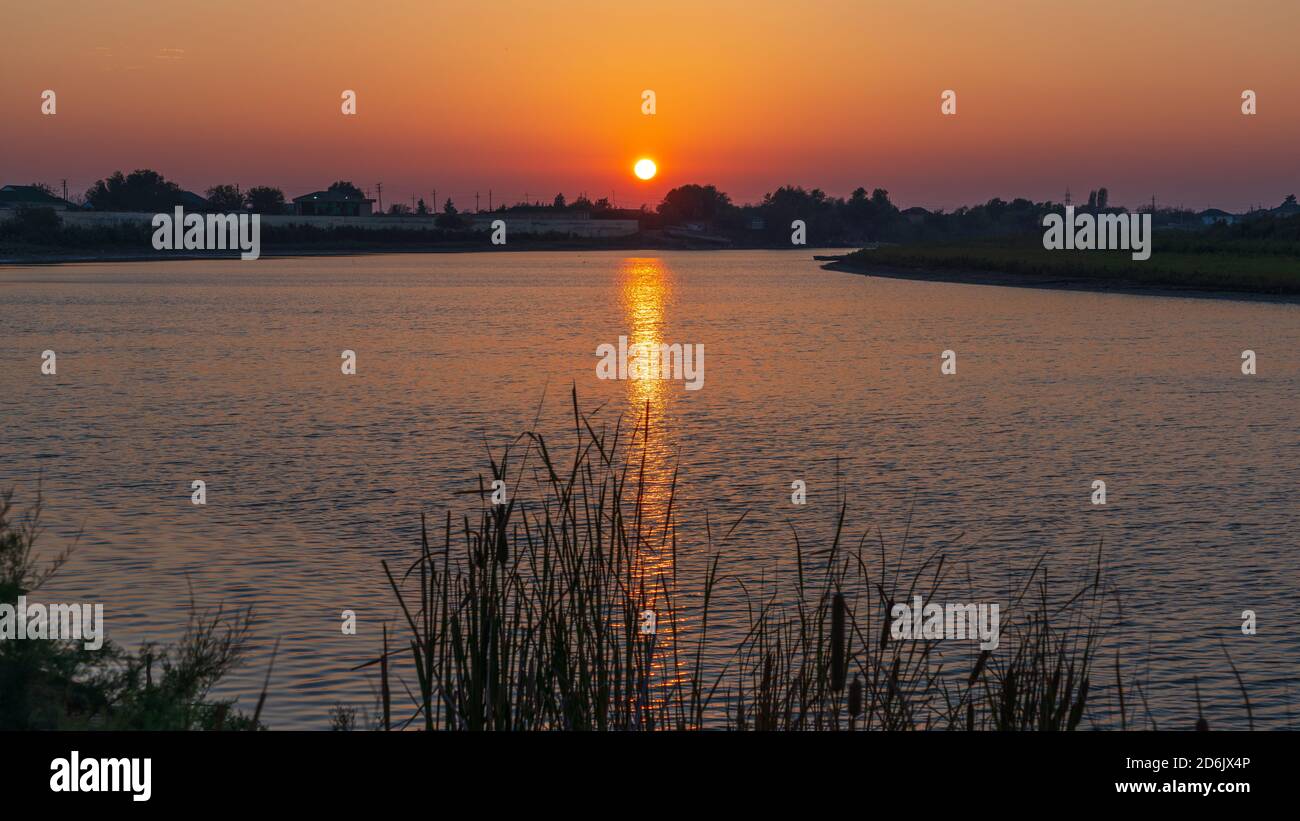 Colorful sunset on the river Stock Photo - Alamy