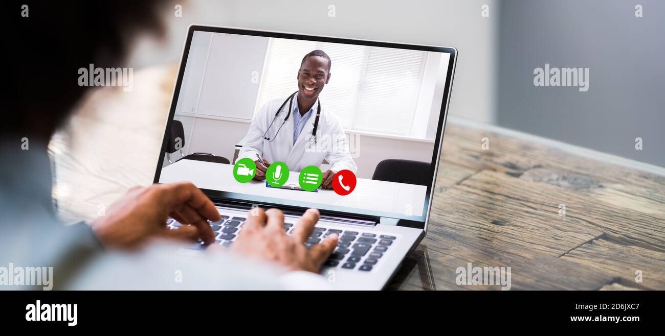 Consult Doctor Online In Video Webinar On Computer Stock Photo - Alamy
