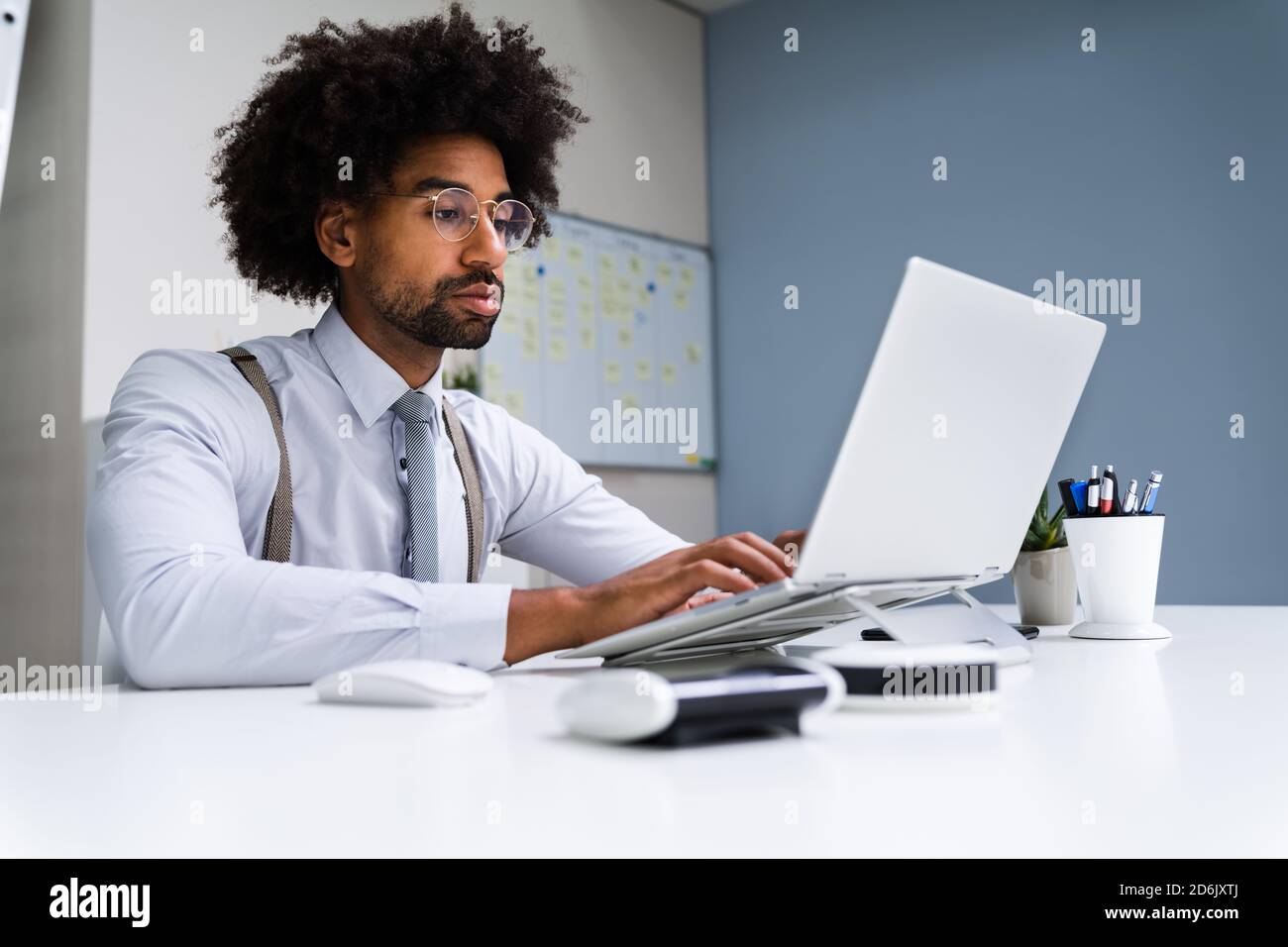 African American Business Man Using Laptop Computer In Office Stock ...