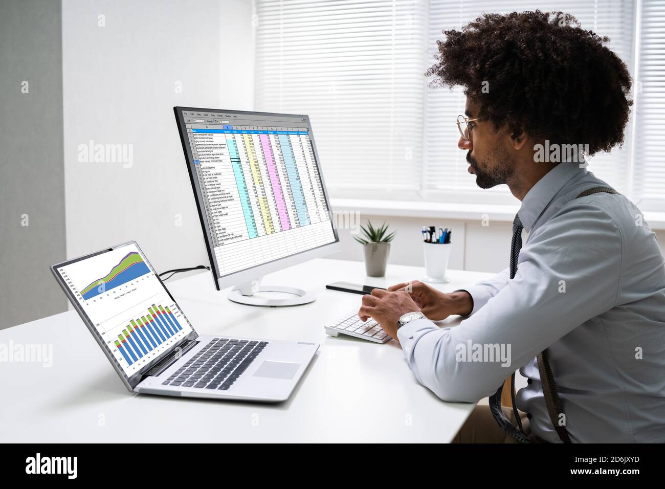 Analyst Employee Working With Spreadsheet On Computer Stock Photo - Alamy