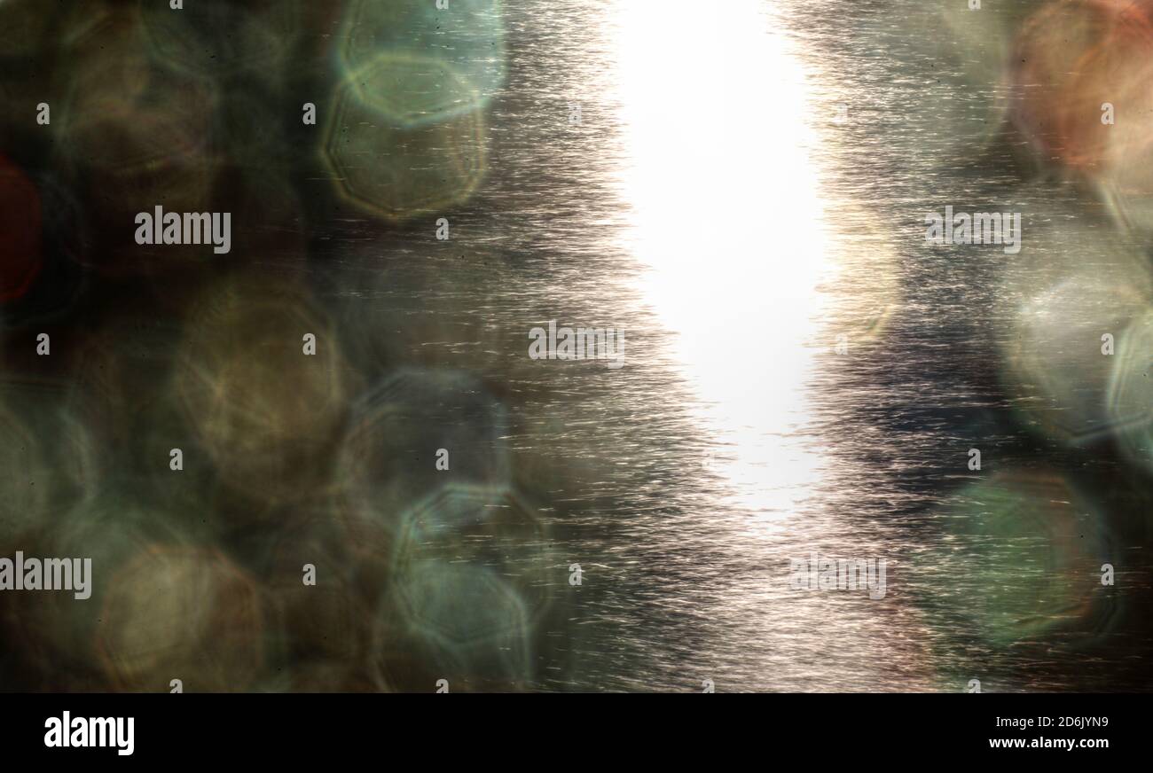 Abstract shot of sunlight reflections on the water and lens flare bokeh ...