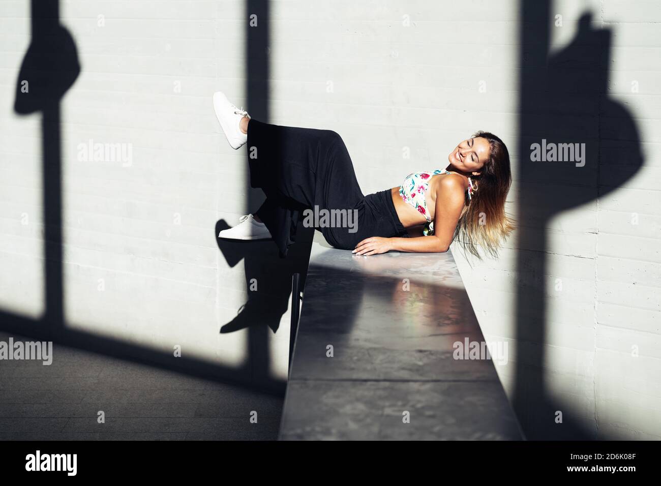 Young girl moving her legs in an urban background Stock Photo - Alamy
