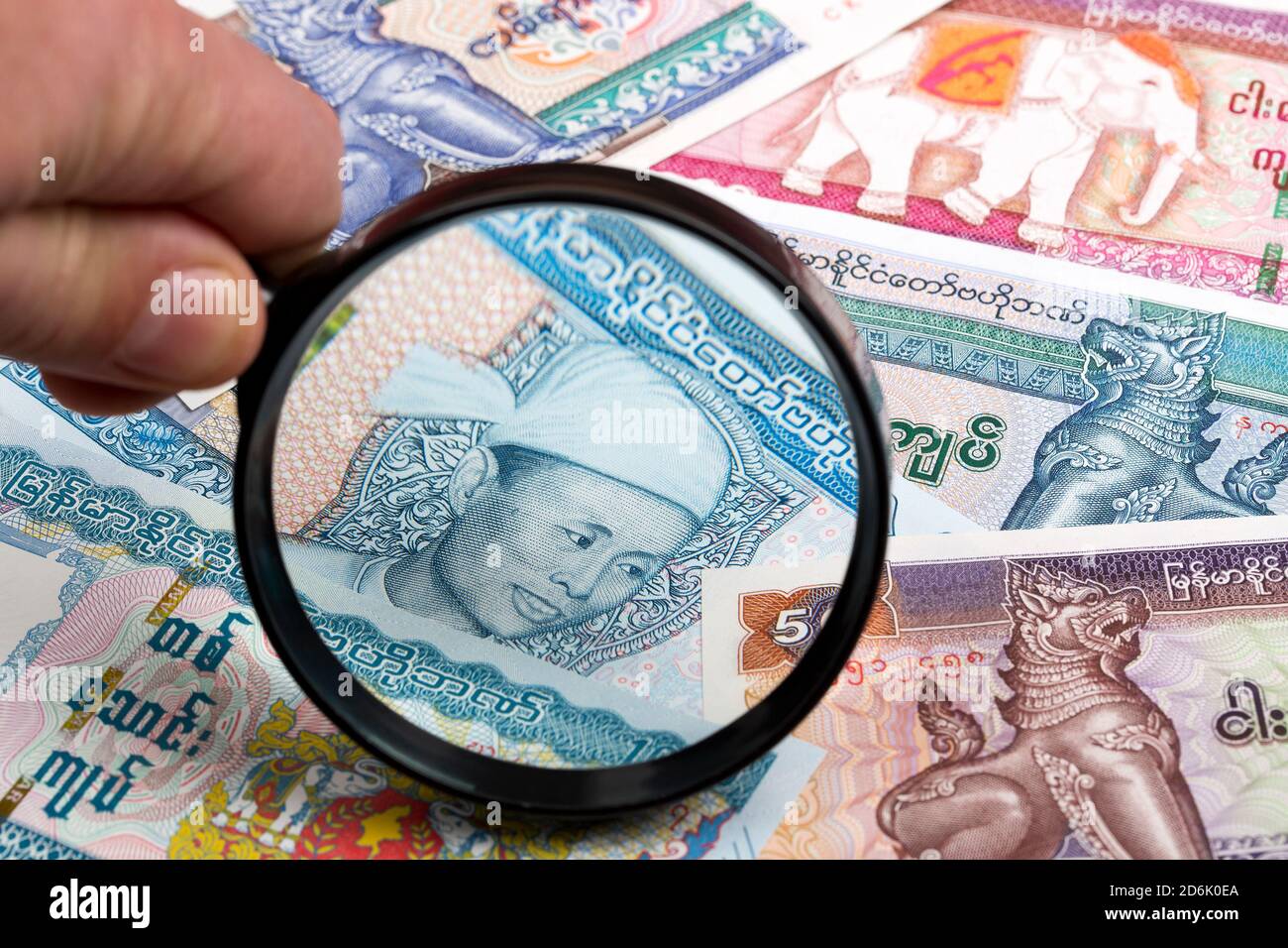 Burmese kyat in a magnifying glass Stock Photo - Alamy