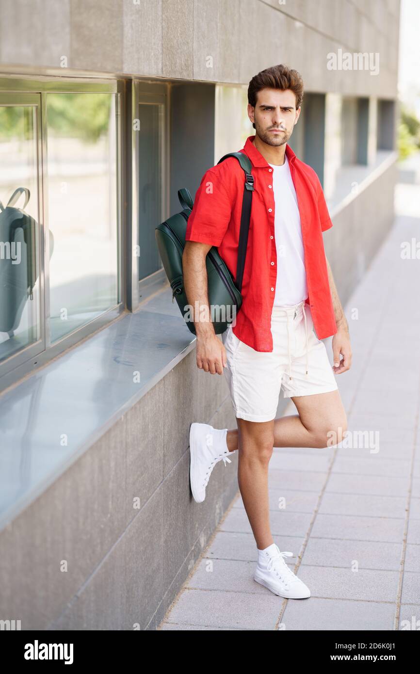 Man wearing backpack shorts hi-res stock photography and images - Alamy