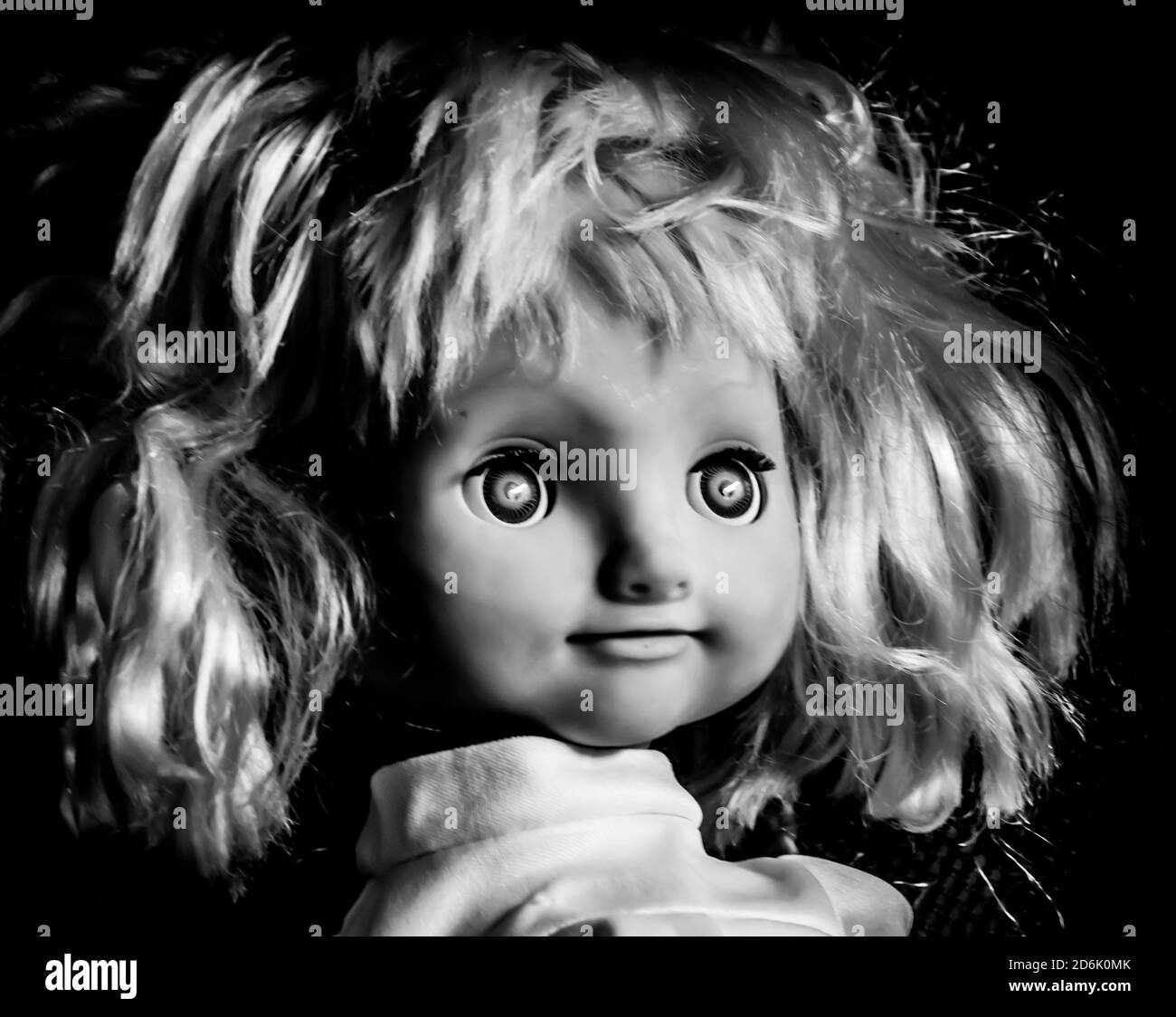 Creepy girl doll face. It seems like character of horror movie. Angry ...