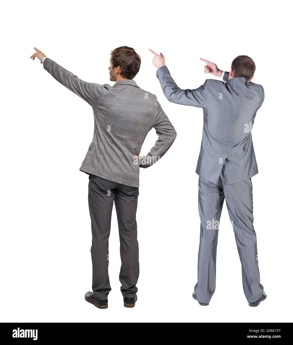Back view of business man and business woman in suit pointing. Business ...