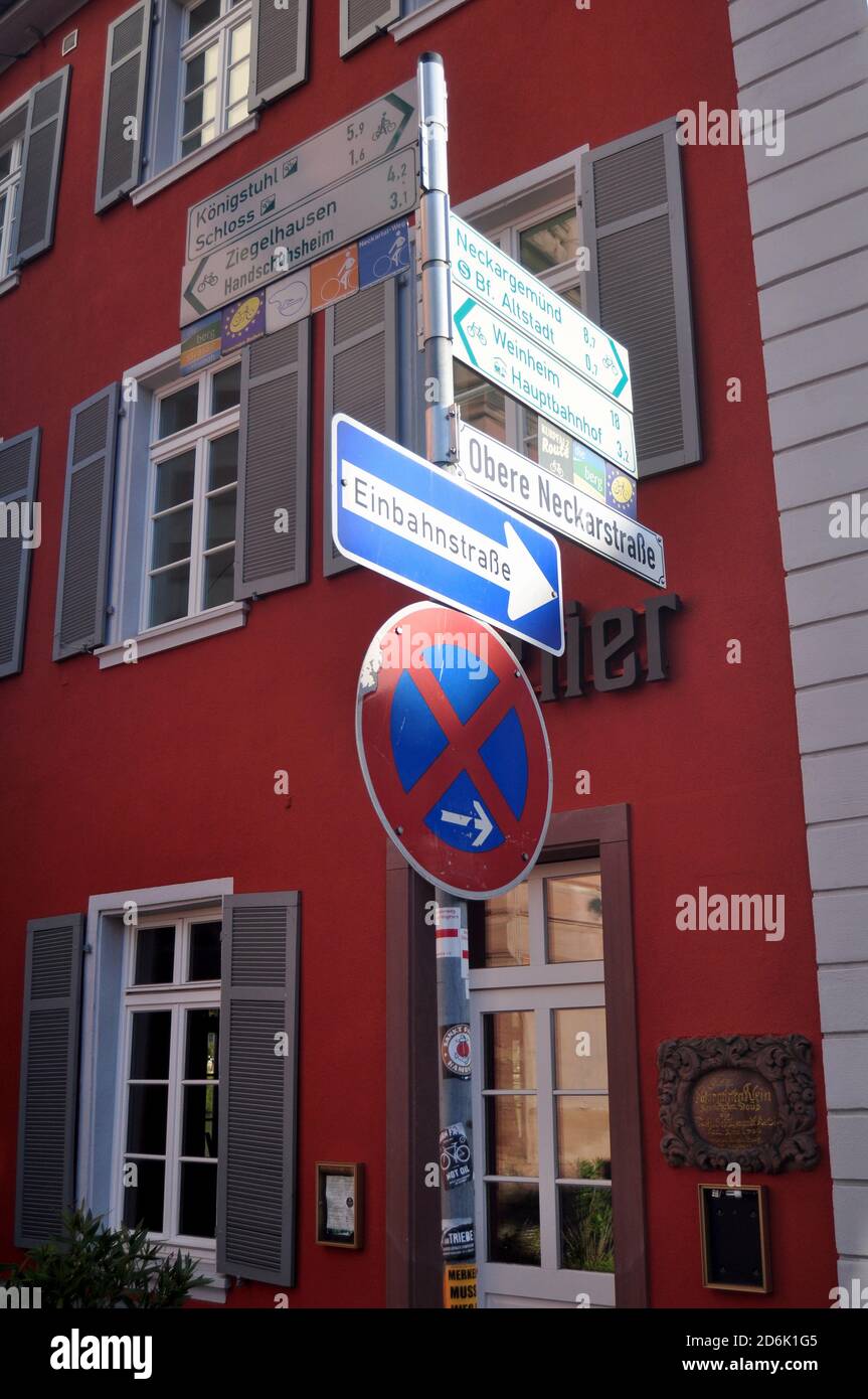 Direction guide signpost on street in alley for people looking at ...