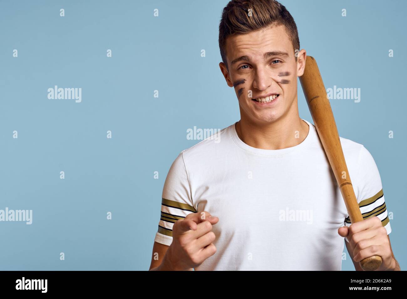baseball guy with a bat in his hand on a blue background and a combat ...