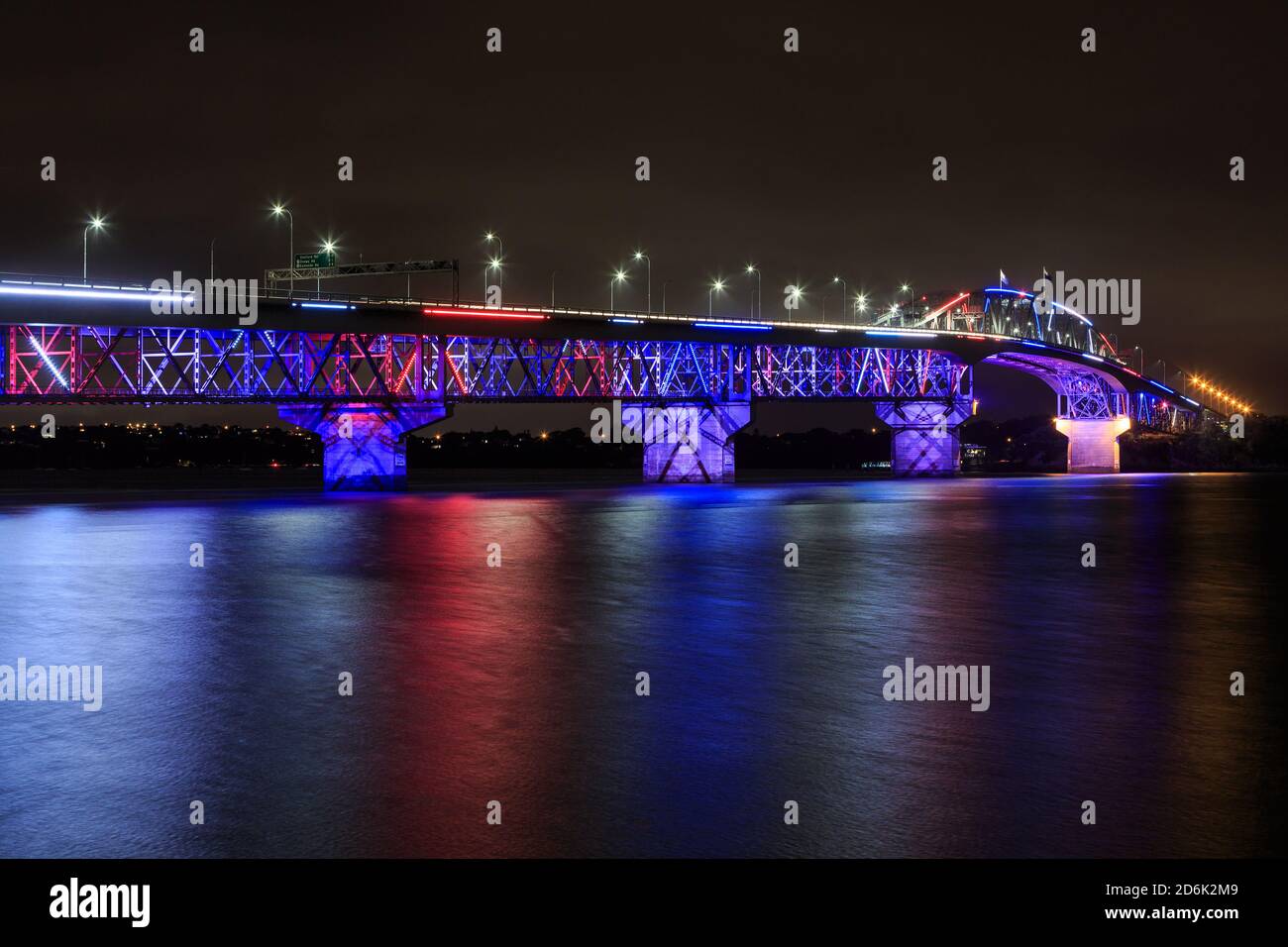 The Auckland Harbour Bridge, Auckland, New Zealand, colorfully lit up ...