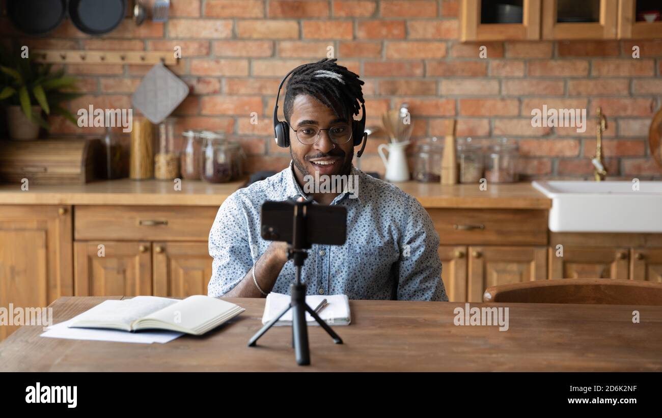 African American male vlogger record video on cellphone Stock Photo - Alamy