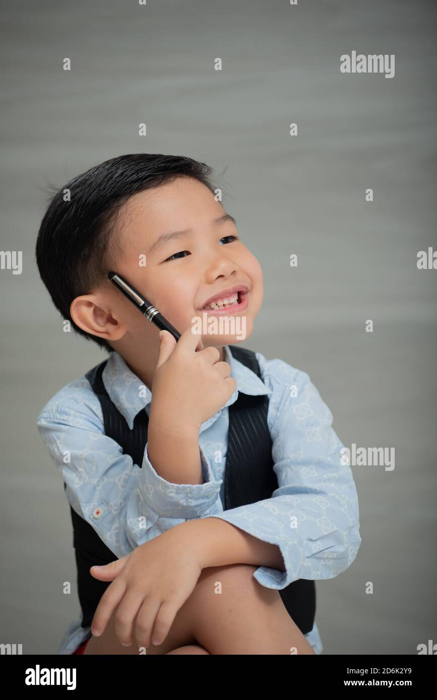 Asian child, looking smart and intellectual Stock Photo - Alamy