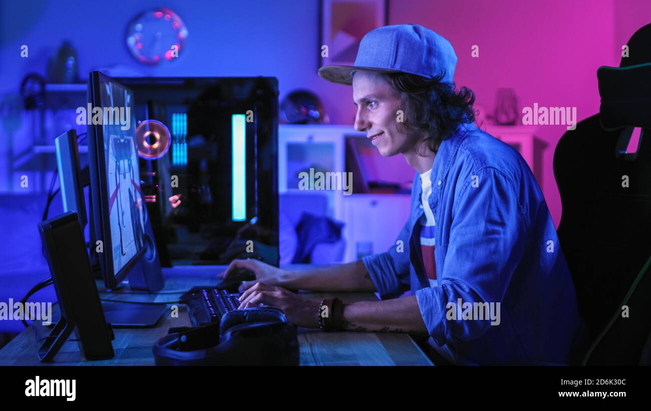 Professional Gamer Playing First-Person Shooter Online Video Game on ...